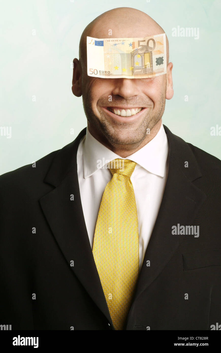 Man with money on his forehead Stock Photo - Alamy