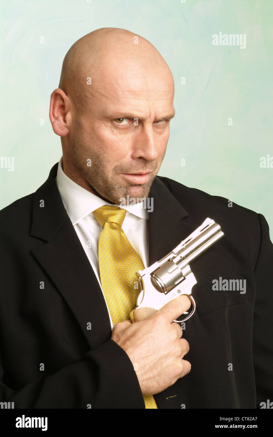 Man posing with gun Stock Photo - Alamy