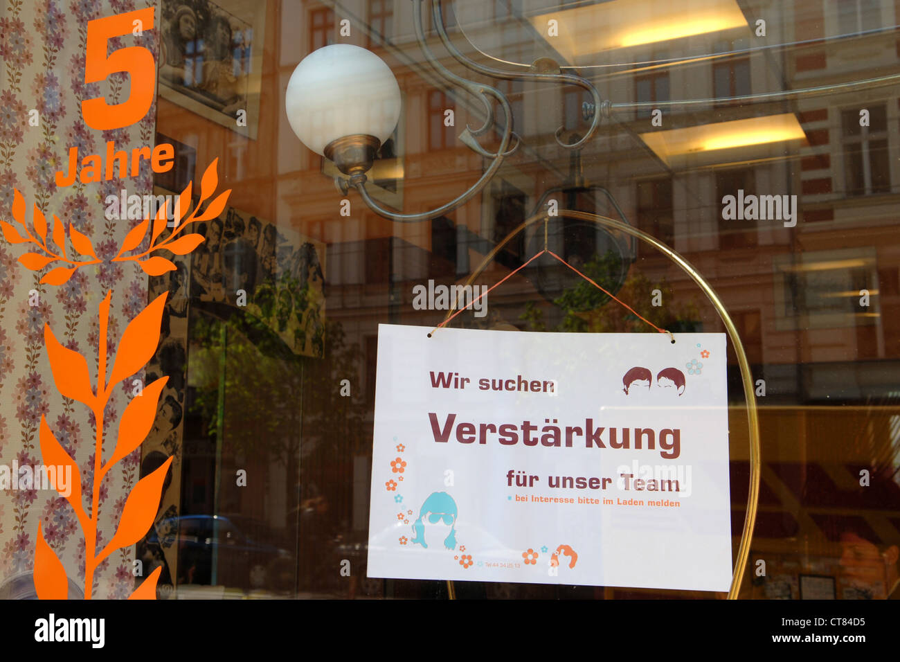 Advertisements in shop windows, Berlin Stock Photo - Alamy