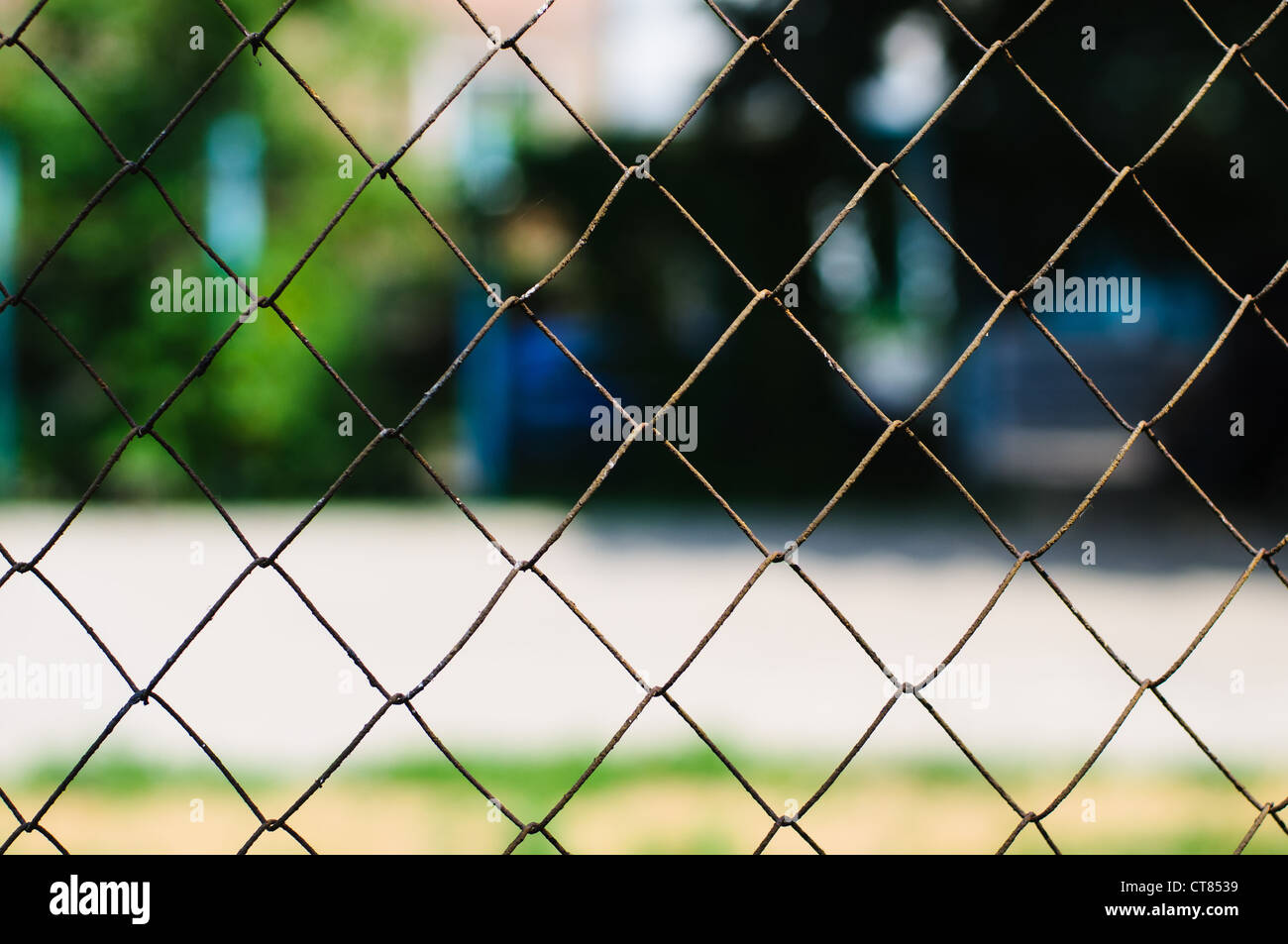 Rusted chain link fence with out of focus background Stock Photo - Alamy