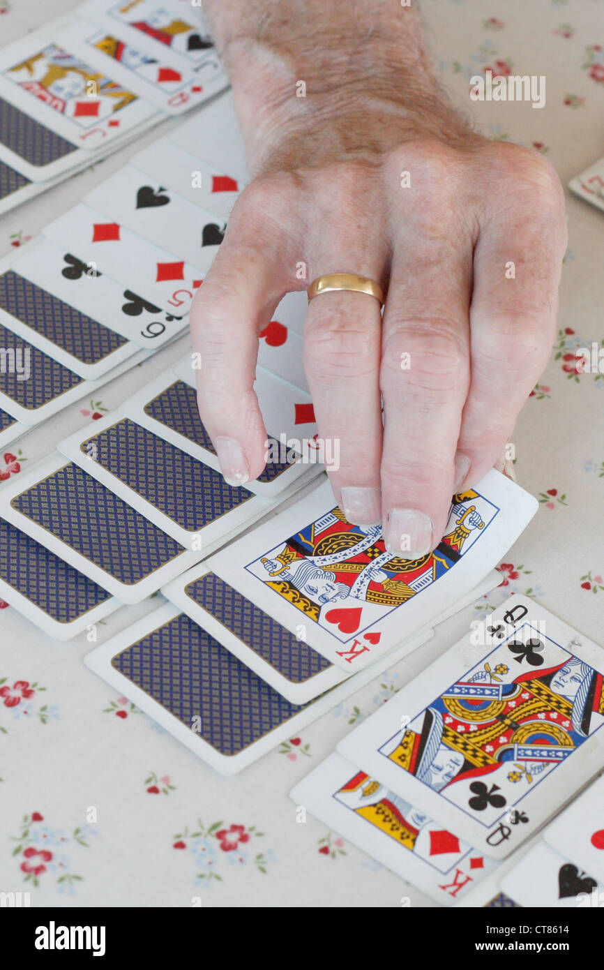 Senior playing solitaire Stock Photo - Alamy