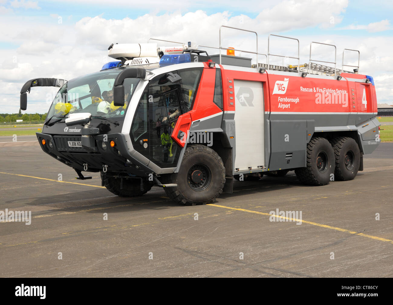 Airport fire tender at Farnborough airport England. Engine jet exhaust ...