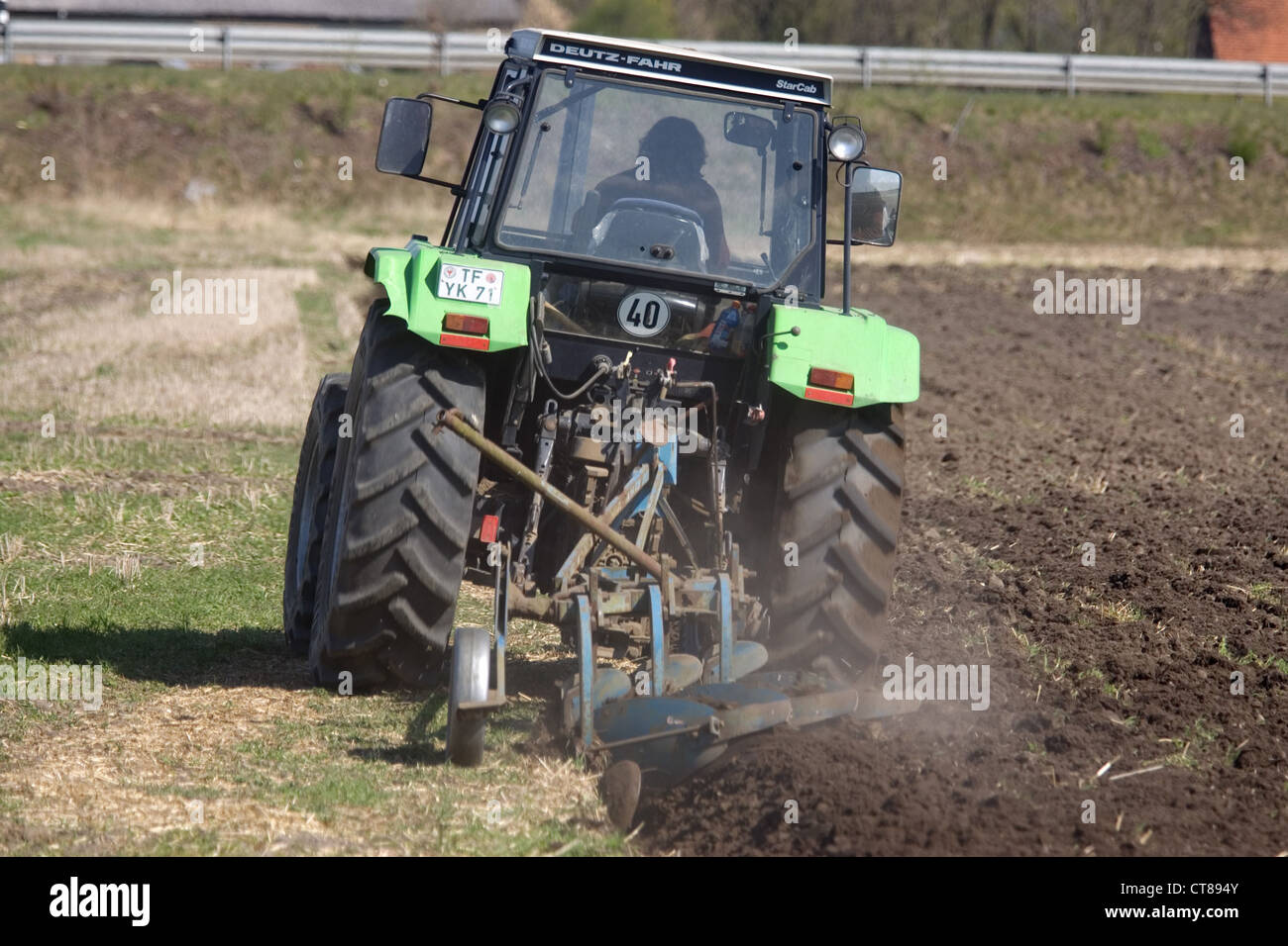 Farmer harrowing field hi-res stock photography and images - Alamy