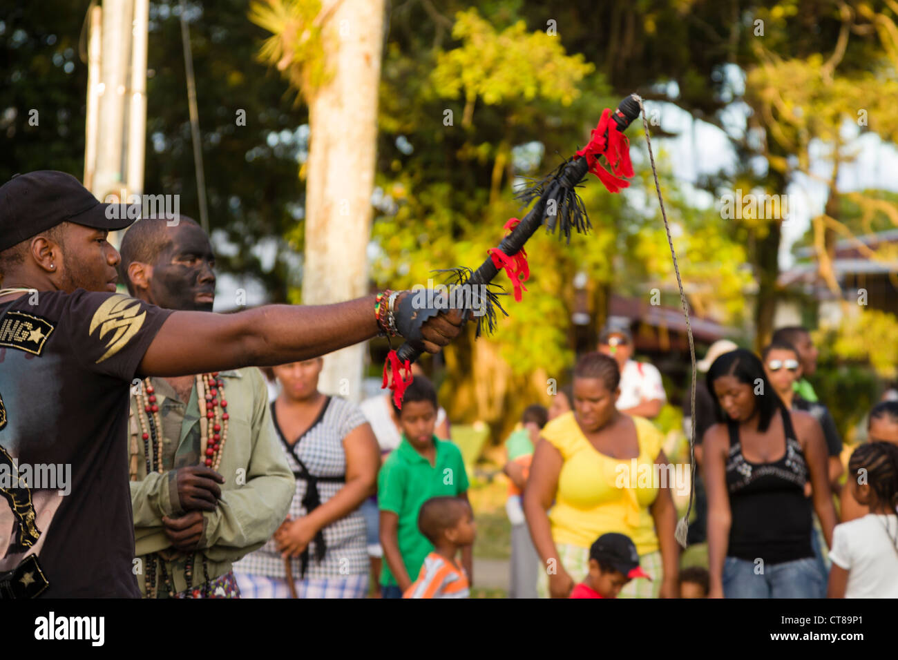 Man waving whip during Panamanian Carnival celebration on Isla Colon ...