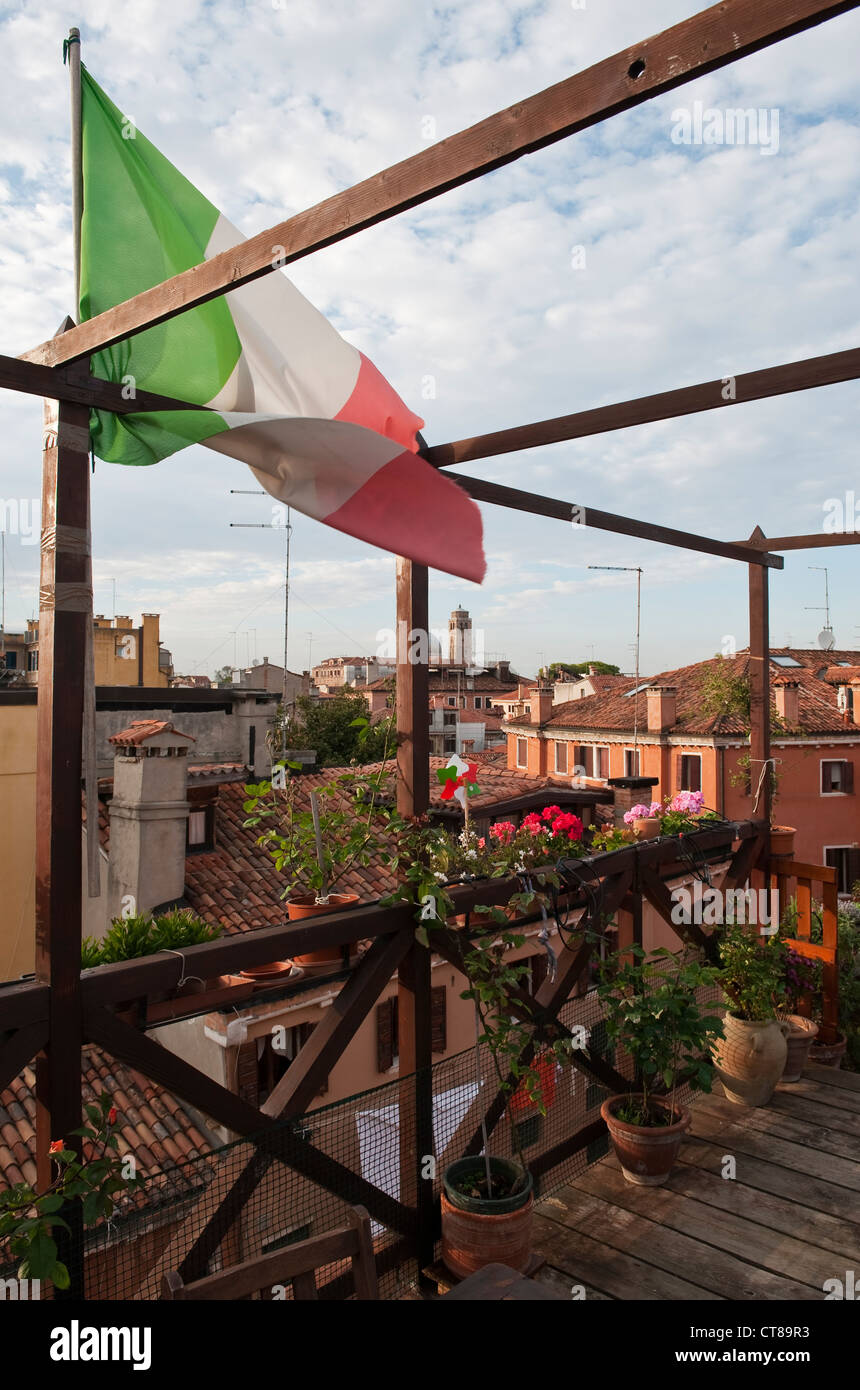 The Italian flag flying over an 'altana' on the roof of a house in ...