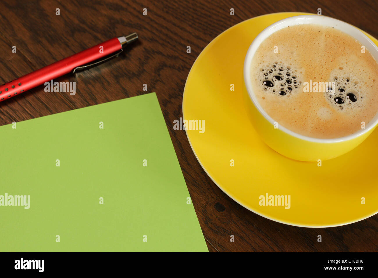 Yellow cup of coffee Stock Photo - Alamy