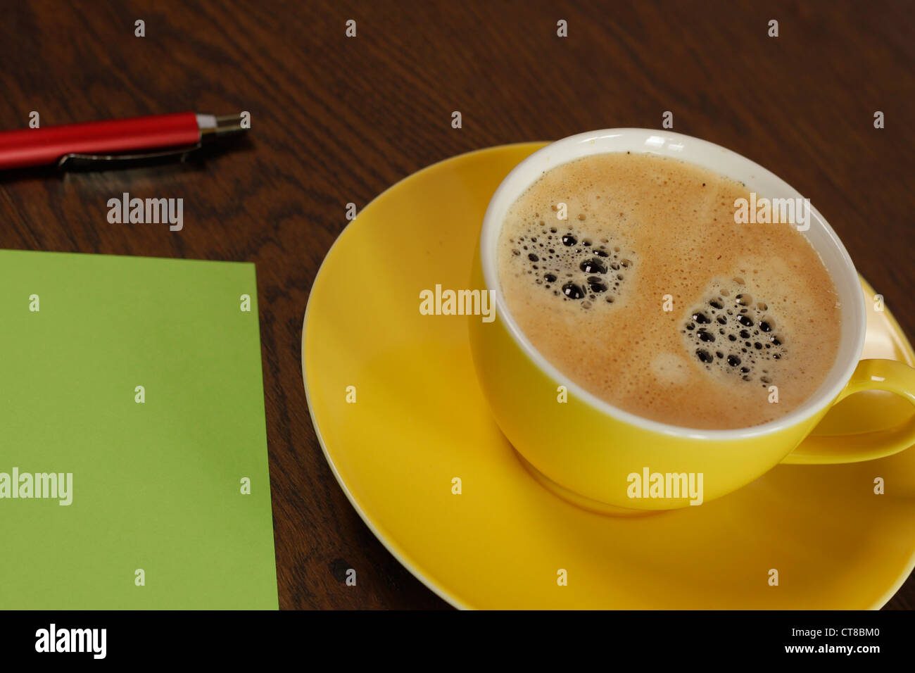 Yellow cup of coffee Stock Photo - Alamy