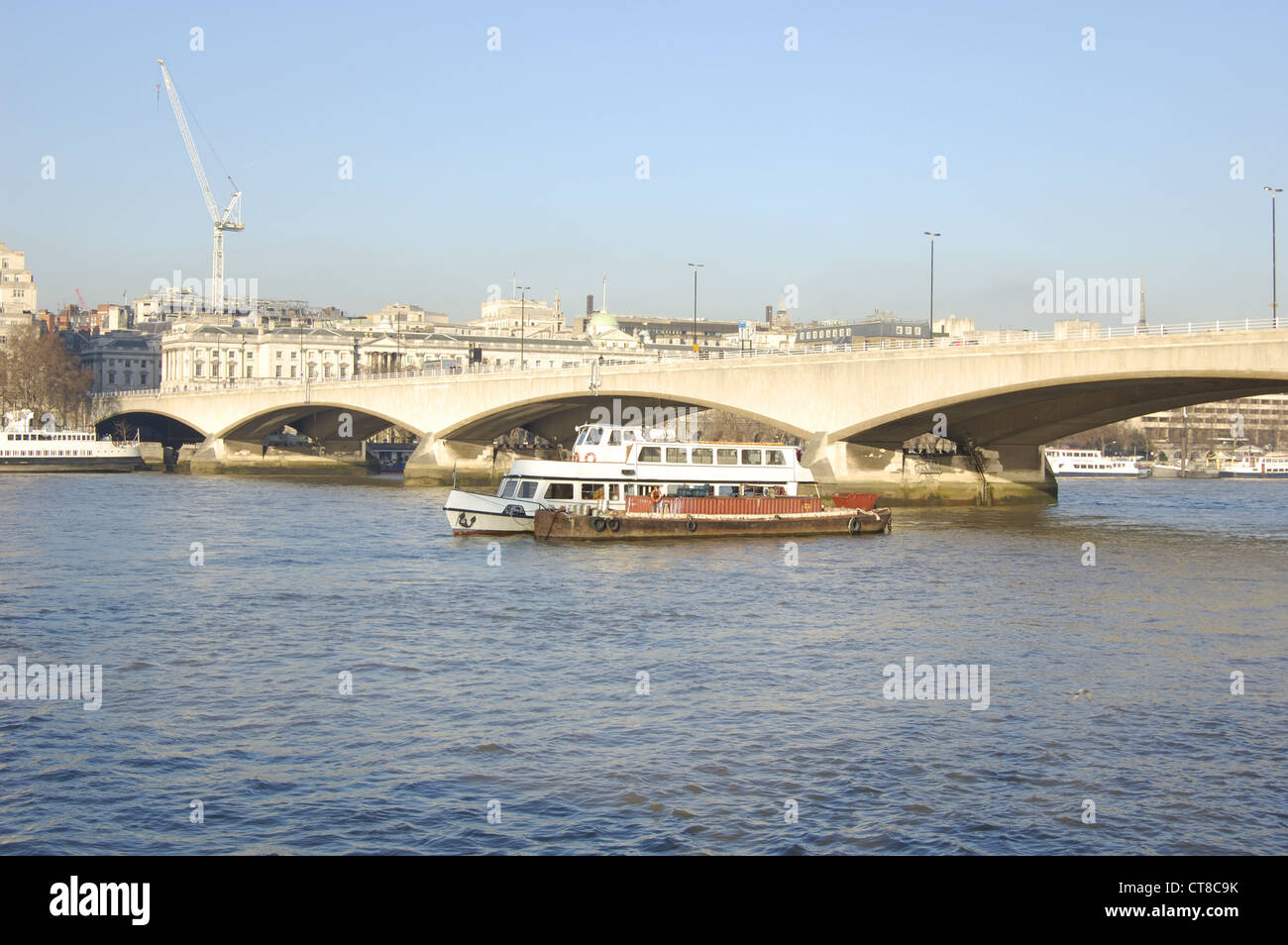 Waterloo Bridge and boats on the River Thames in London, England Stock ...