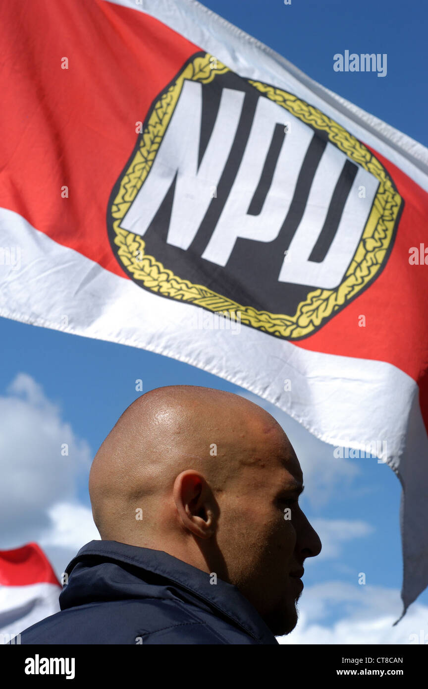 Demonstrators and flag logo with the NPD in Berlin Stock Photo - Alamy