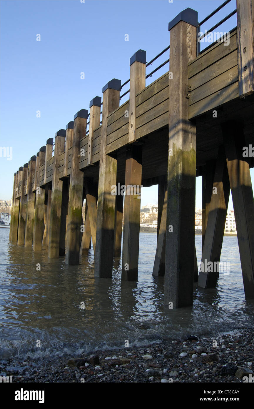 Wooden pier on the South Bank of the River Thames in London, England ...