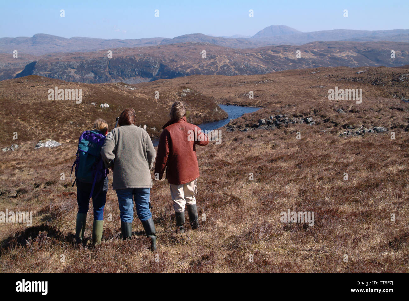 Woman hillwalking in spectacular countryside, Sutherland, Scotland, UK ...