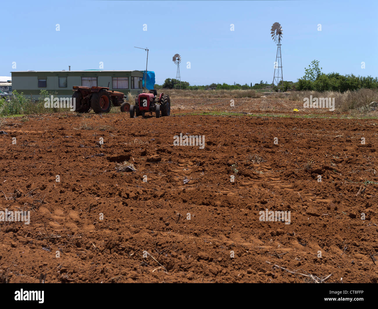 dh AYIA NAPA AREA CYPRUS Farm Red soil field farmland tractors caravan ...