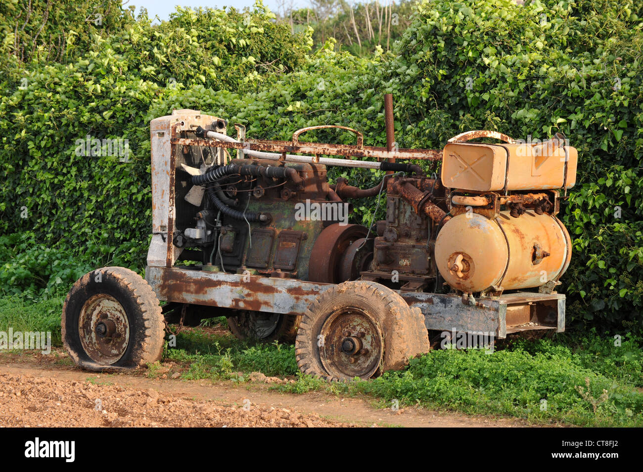 Old tractor on a field Stock Photo - Alamy