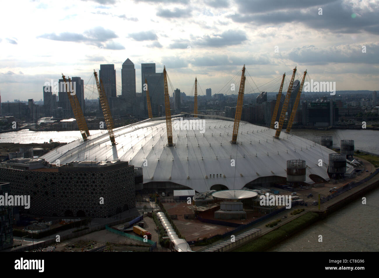 Aerial view of the Millennium Dome in London, with the Thames winding ...