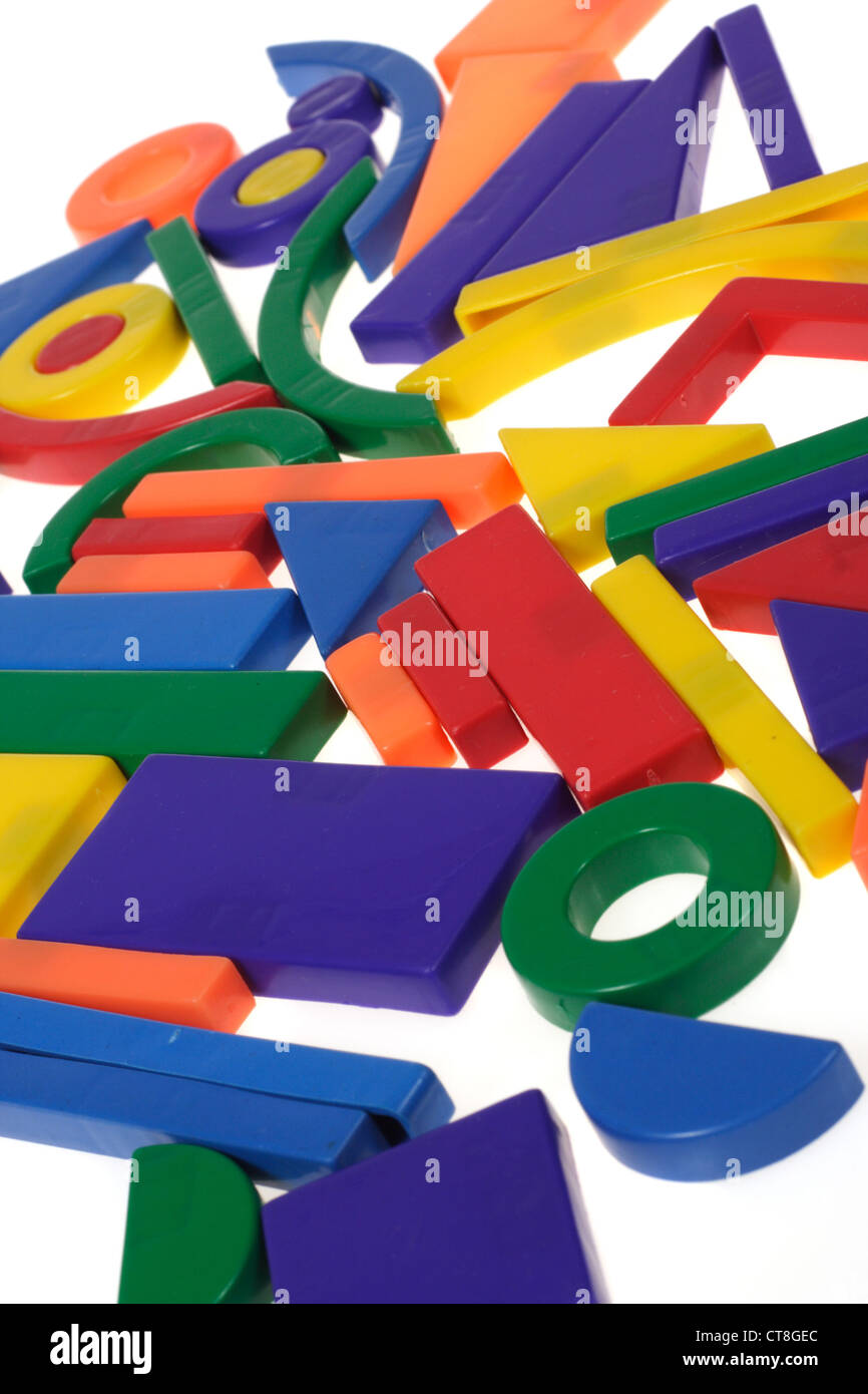 Plastic blocks geometrical figures photo on white background Stock ...