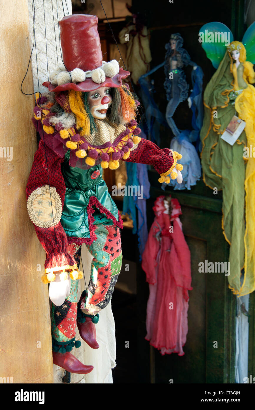 Clown string puppet hanging from shop doorway at Oia on Santorini ...