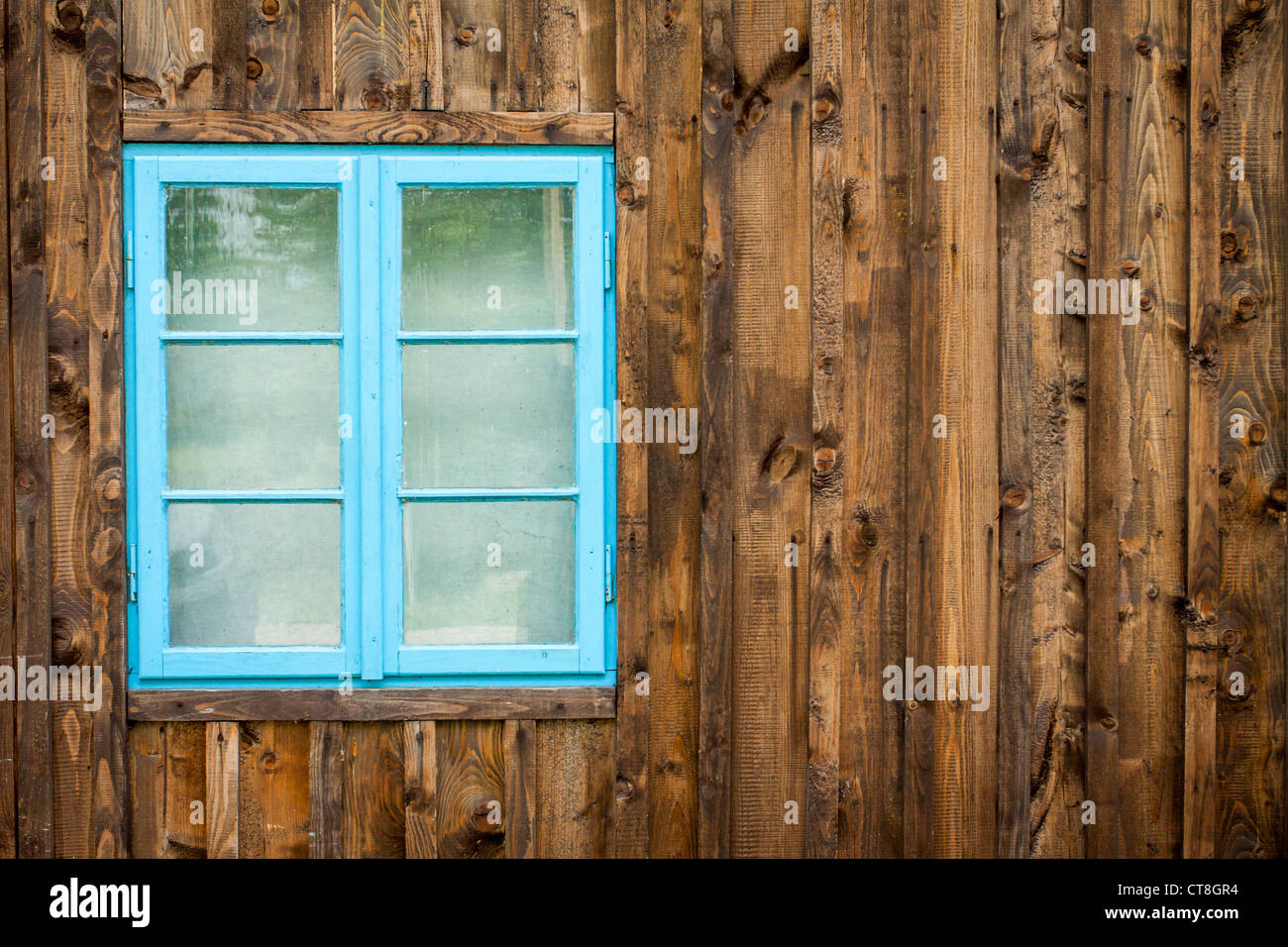 Old home with blue window background Stock Photo - Alamy