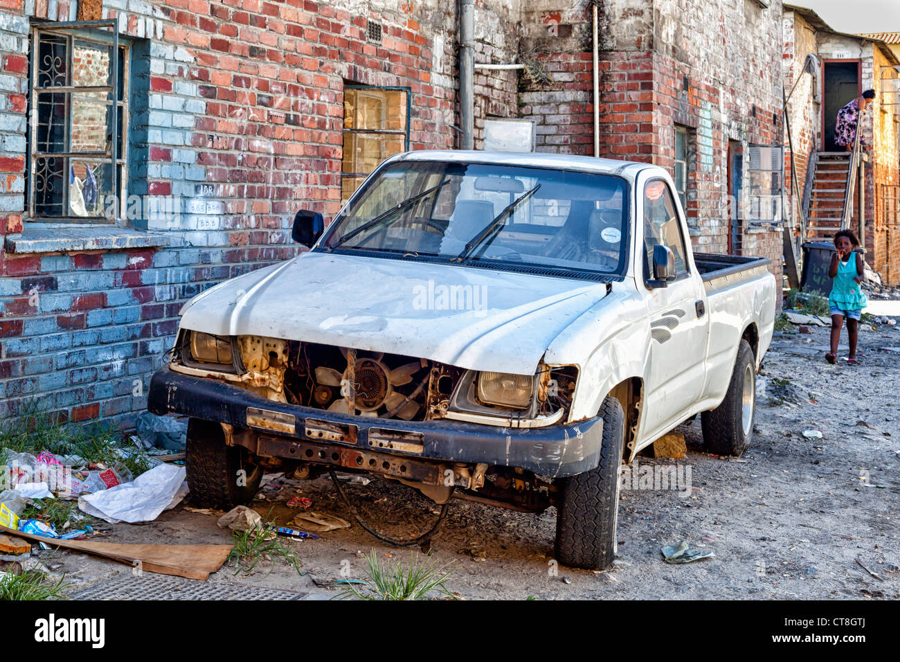 A battered van stands outside the flat dwellings of residents of Langa ...