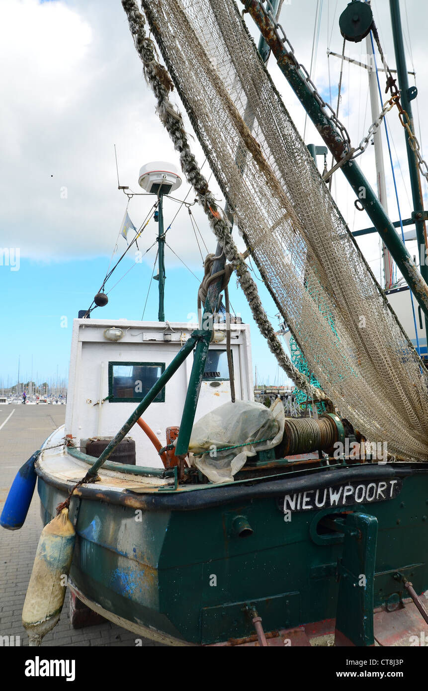 Fishing boat in a ship yard at the Belgian coast waiting to go fishing ...