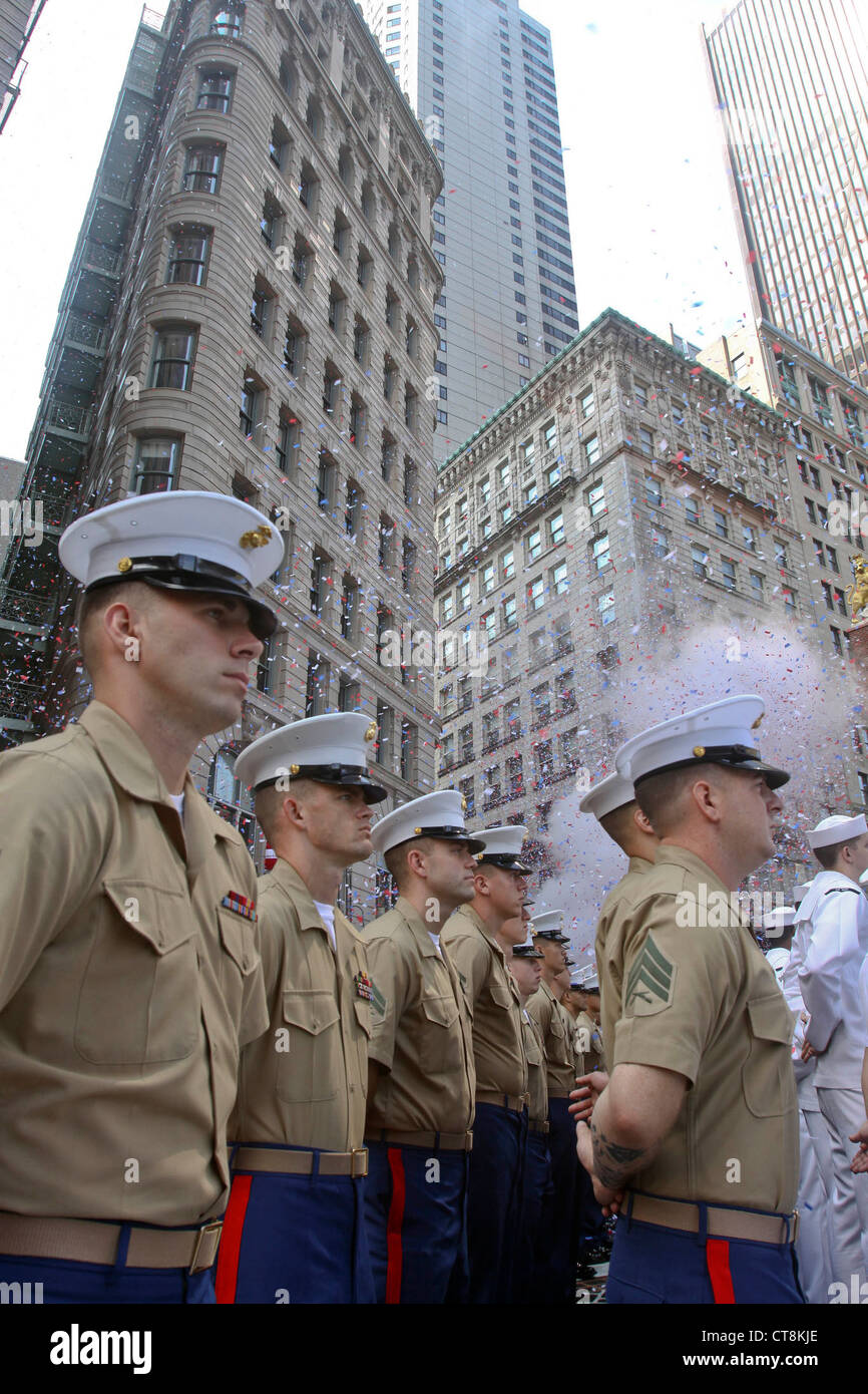 Marines and sailors stand at parade rest during a 4th of July ...
