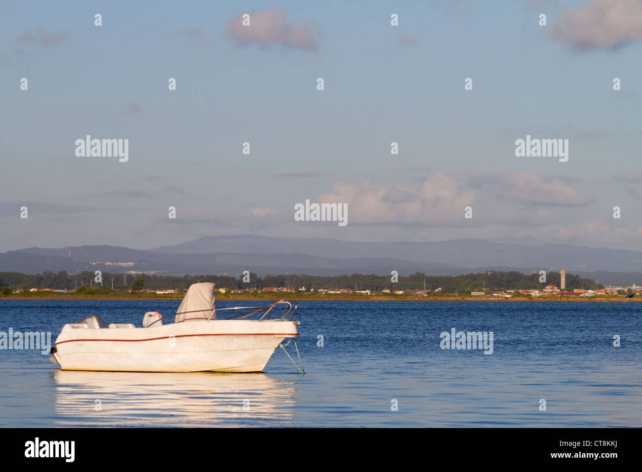 Small Boat floating on riverside Stock Photo - Alamy