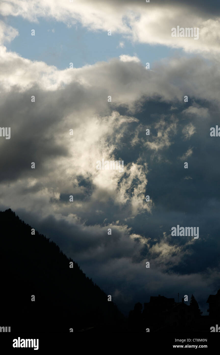 Storm clouds forming above an alpine village Stock Photo - Alamy