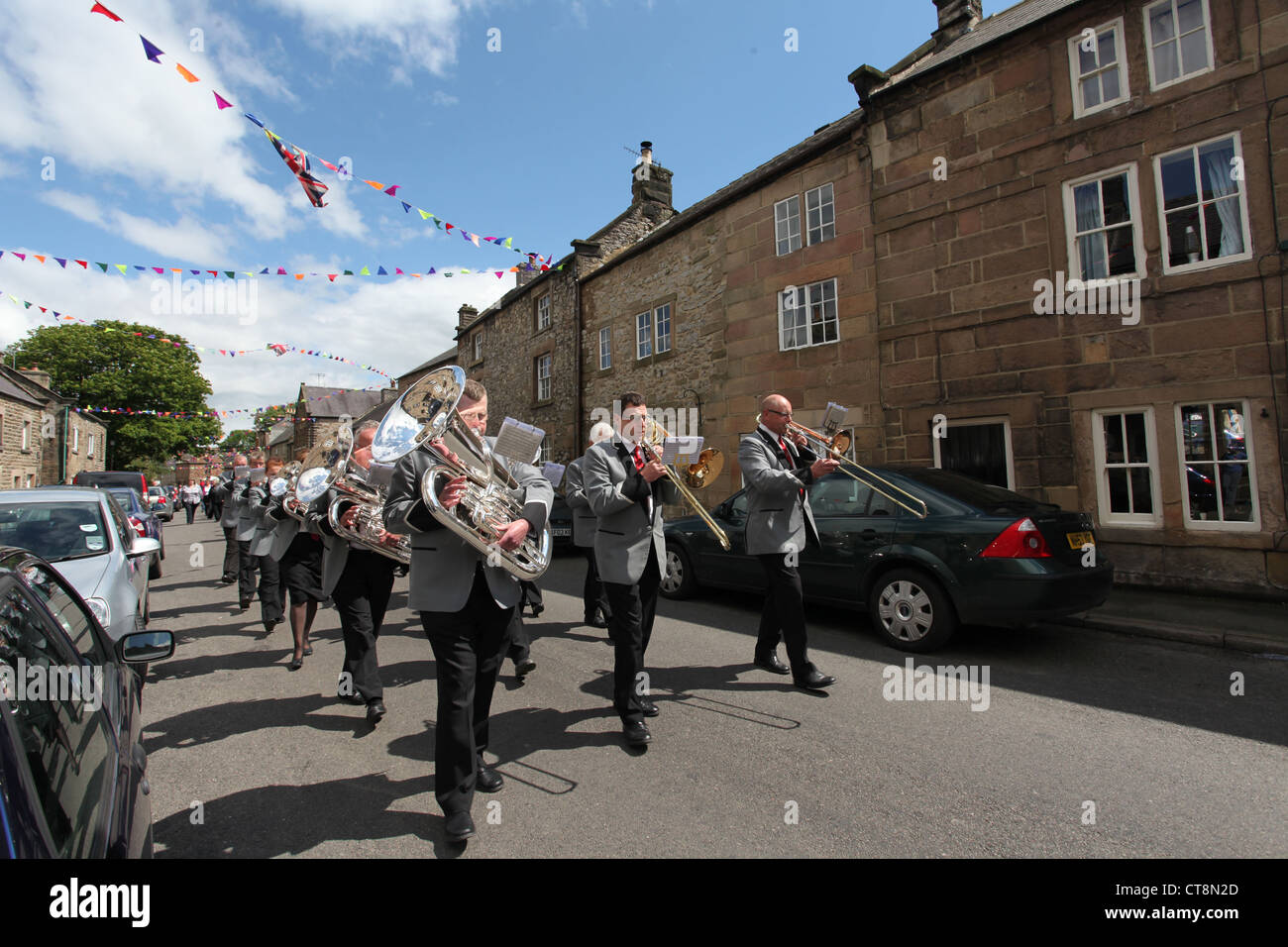 Band Marching Through Peak District Village of Winster Stock Photo - Alamy