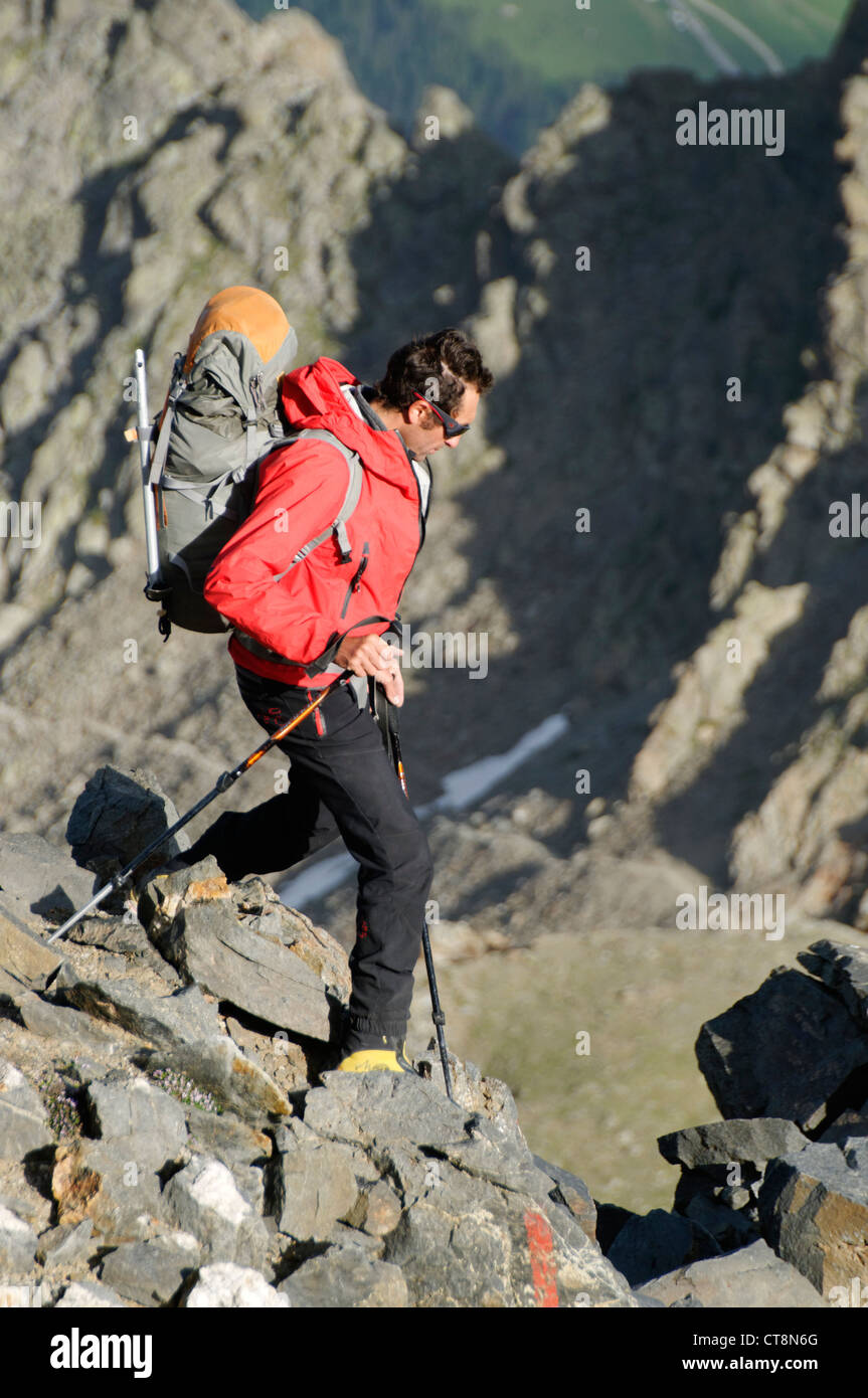 A Mountain Guide running down a mountain path Stock Photo - Alamy