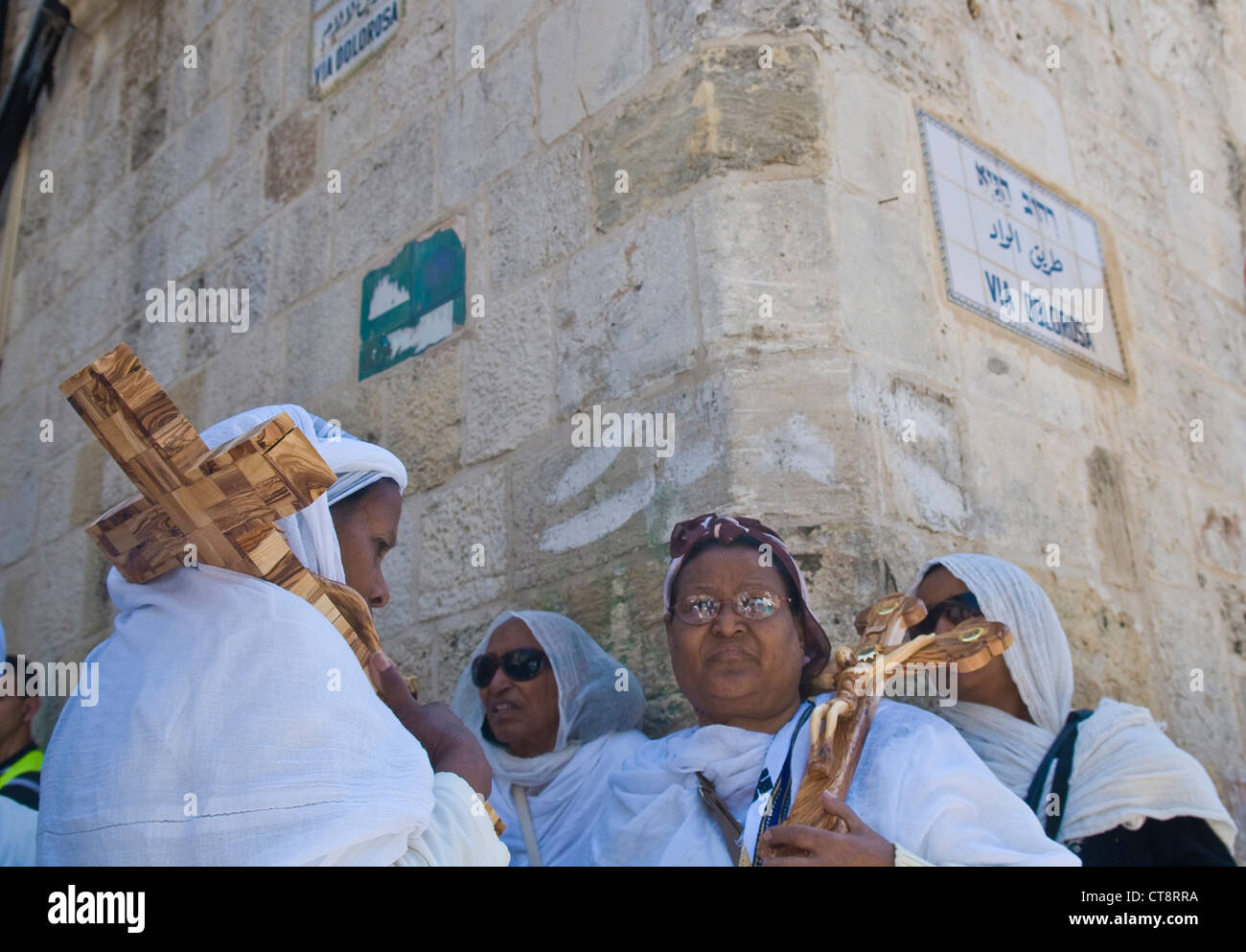 Ethiopian Christian pilgrims carry across along the Via Dolorosa in ...