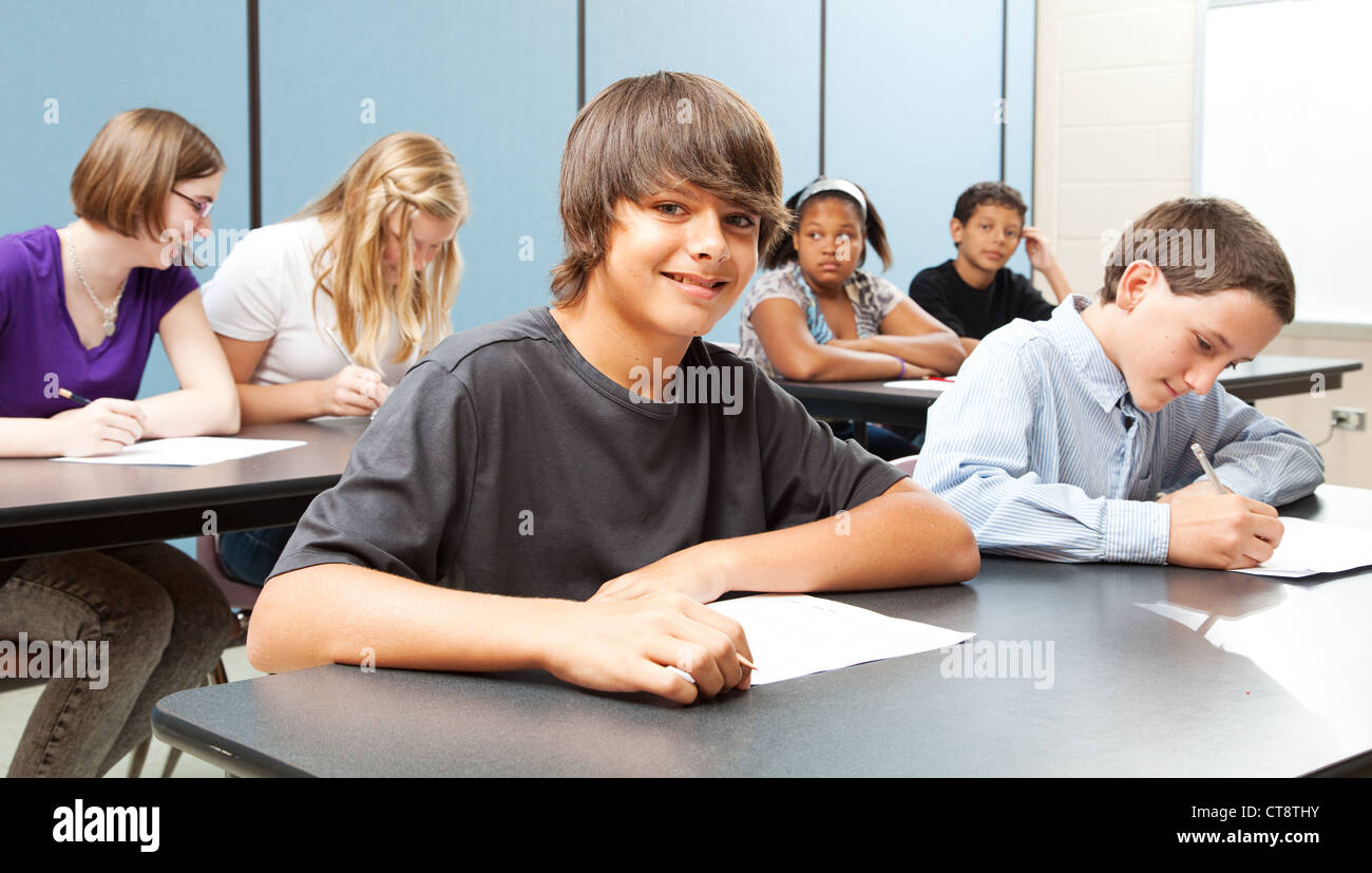 Diverse group of adolescent school children in class. Real kids in real ...