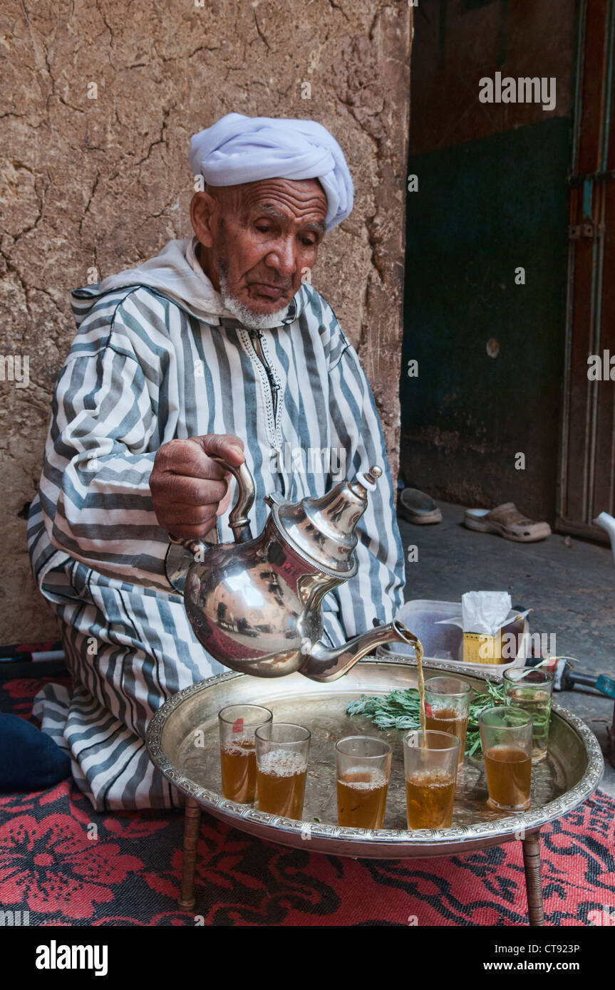 traditional Berber grandfather pouring tea in the Southern Atlas ...