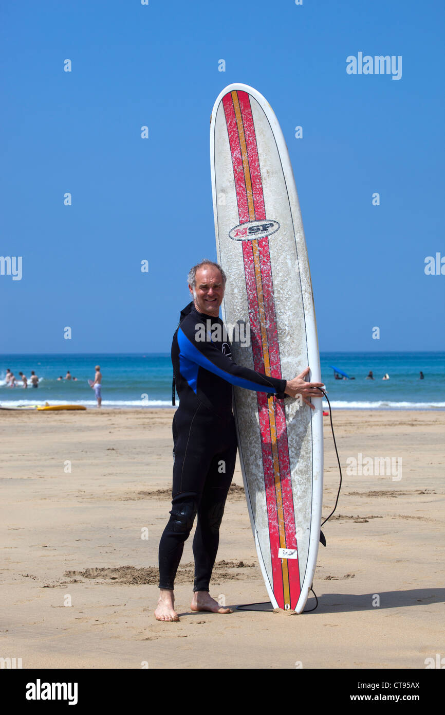 Middle aged Surfer with board on beach at Newquay Stock Photo - Alamy