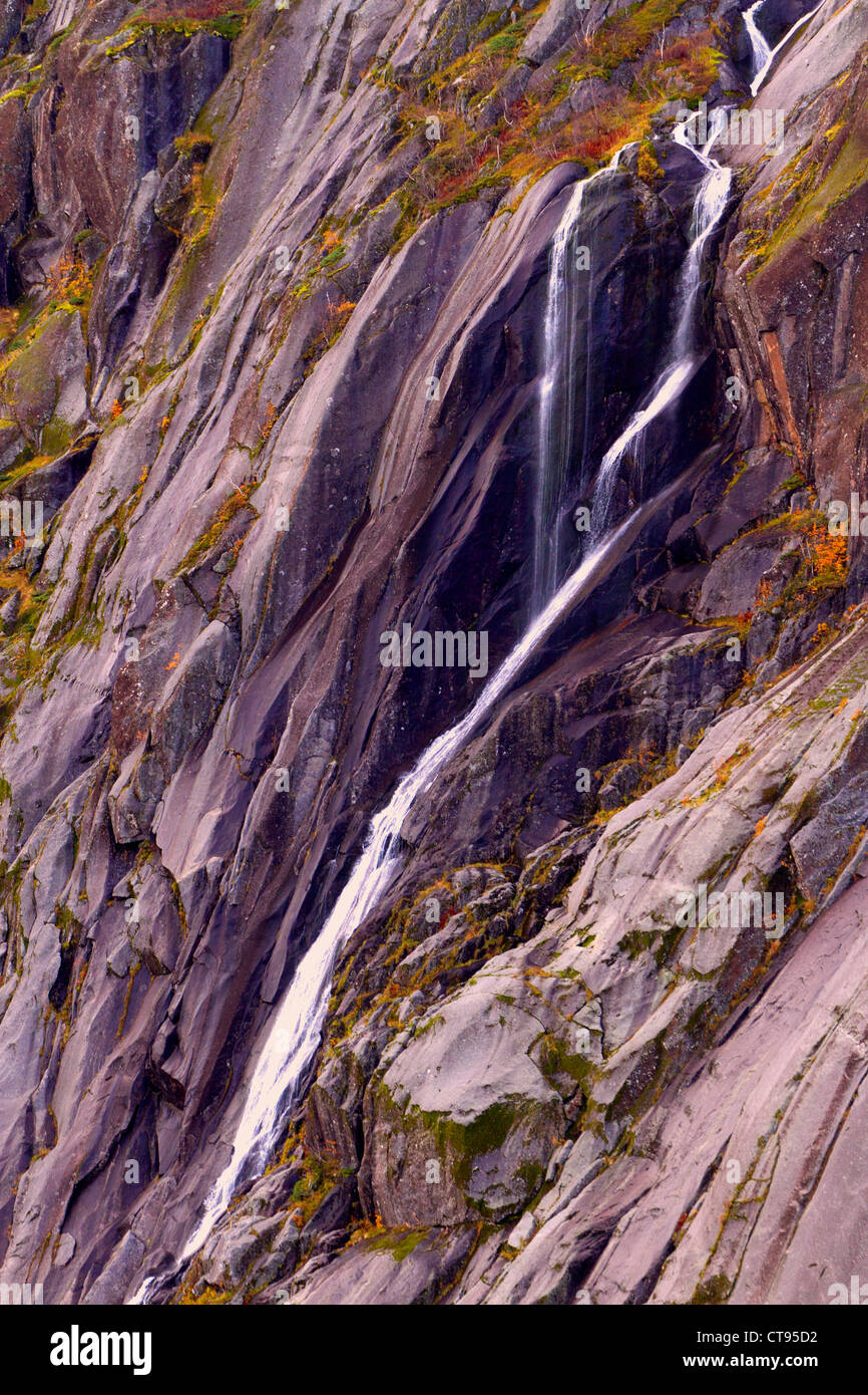 Waterfall plunges down the rock face Stock Photo - Alamy