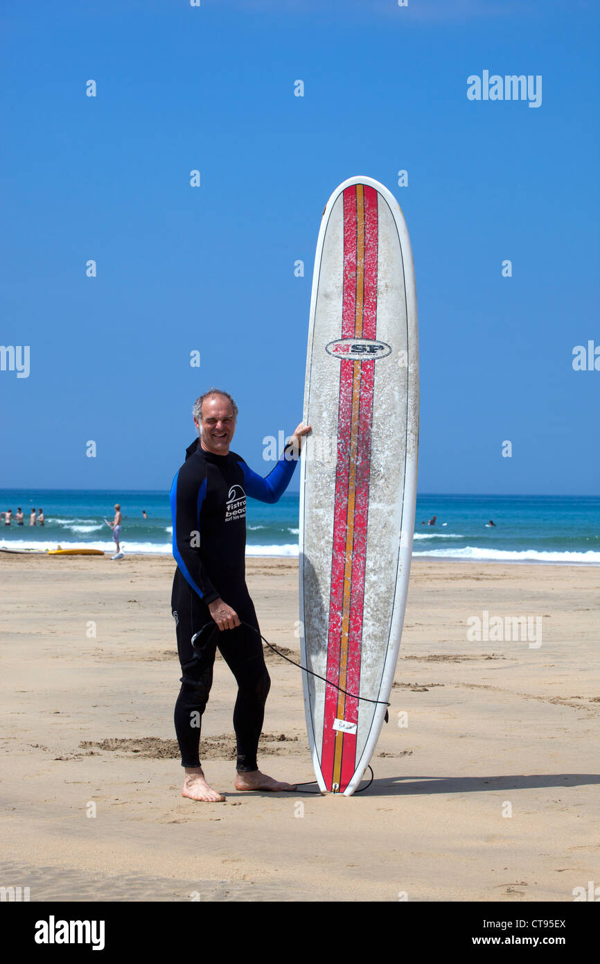 Middle aged Surfer with board on beach at Newquay Stock Photo - Alamy
