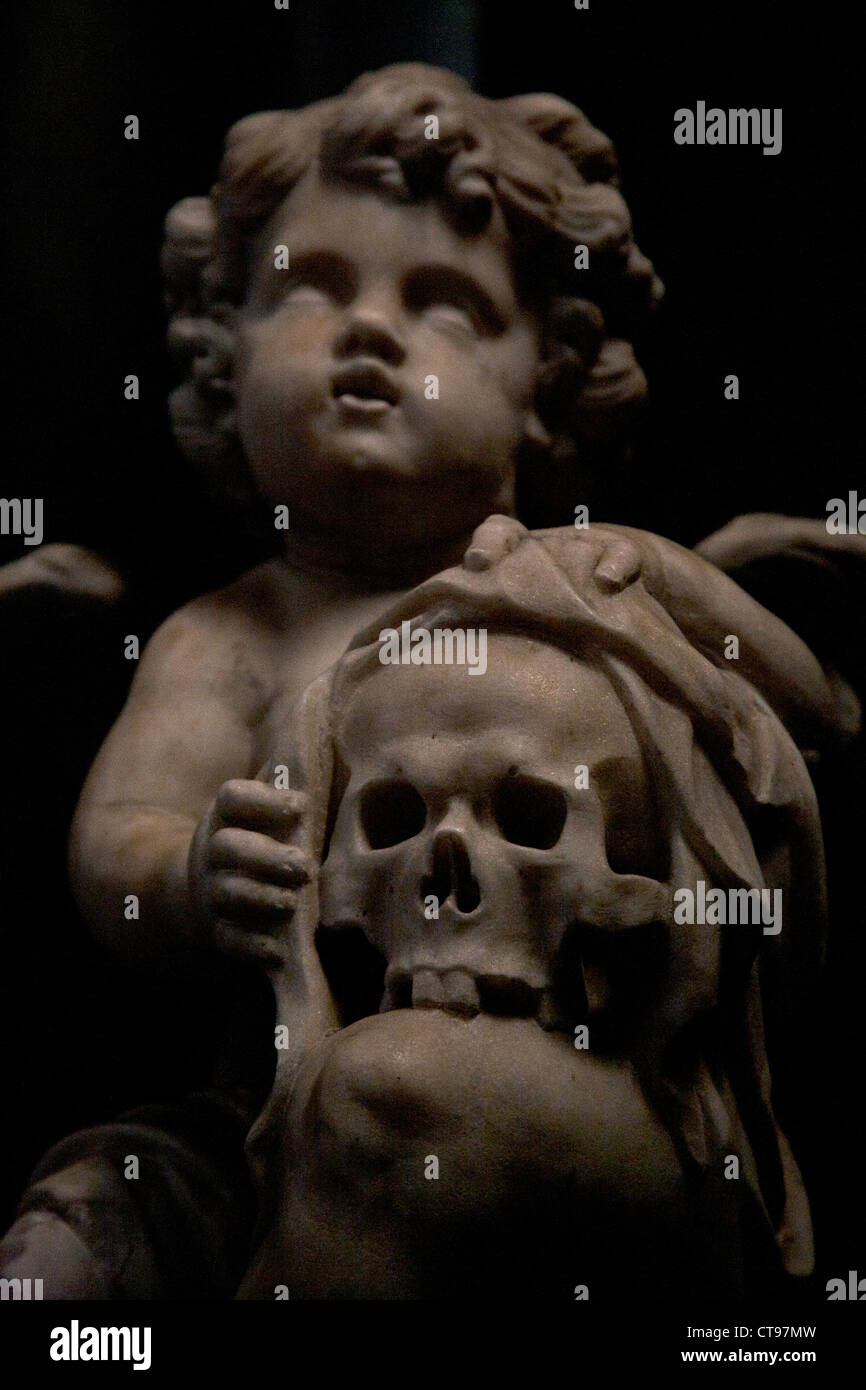 Statue of an angel holding a skull in Saint Bavo Cathedral Ghent ...