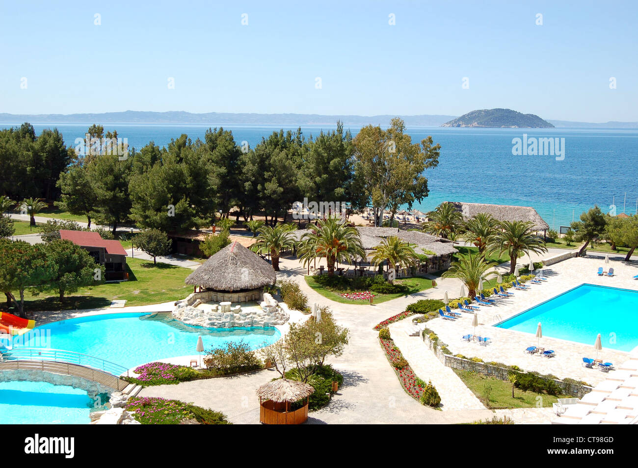 Swimming pools and bar by a beach at the luxury hotel, Halkidiki ...