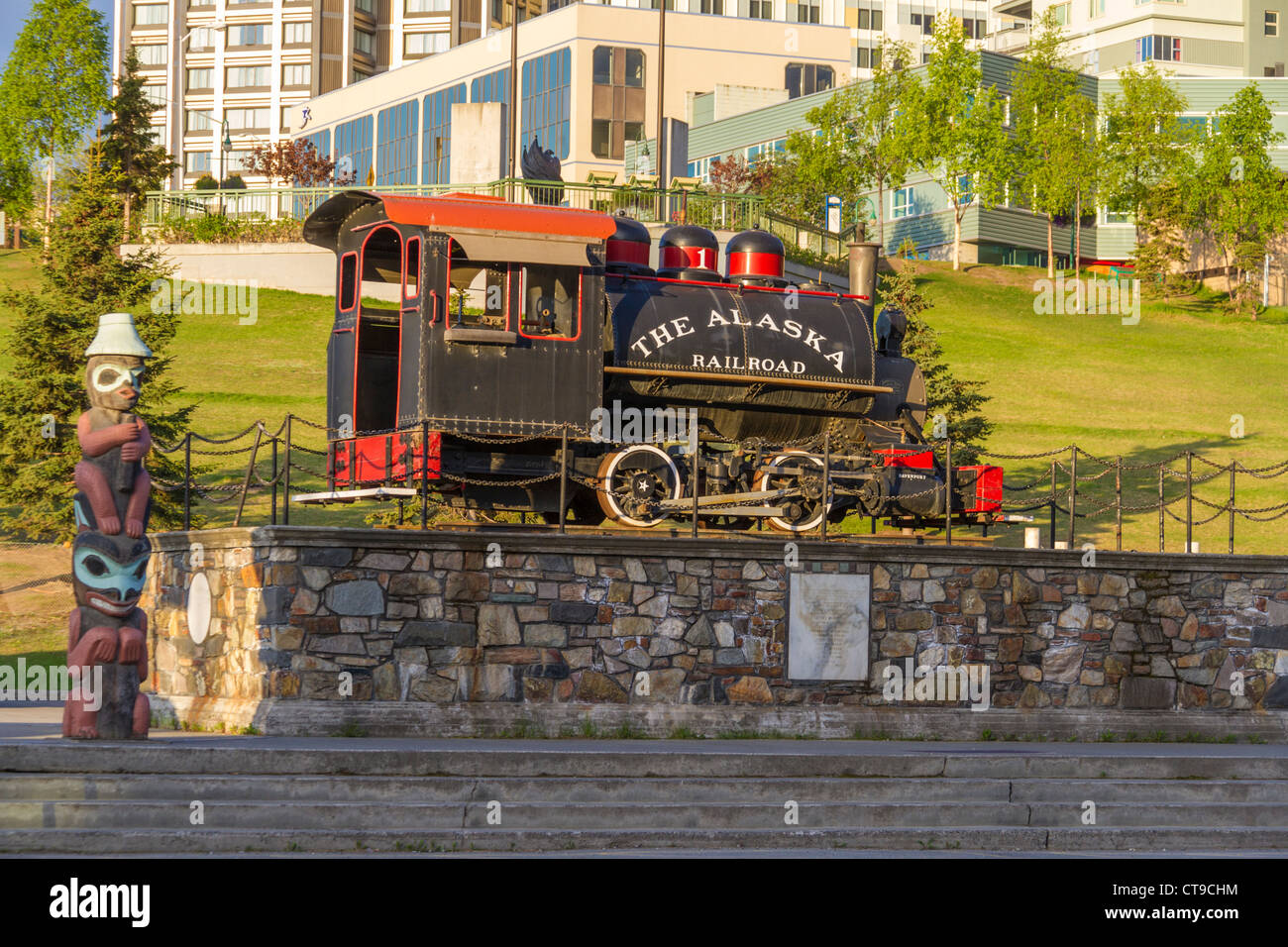 Alaska Railroad historical train statue with downtown Anchorage, Alaska ...