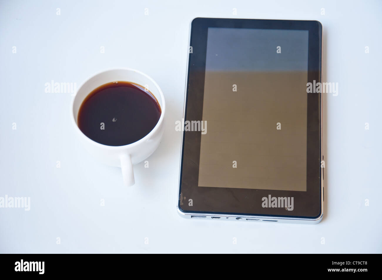 Black coffee and tablet PC on white background Stock Photo - Alamy