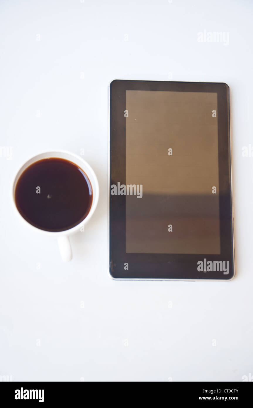 Black coffee and tablet PC on white background Stock Photo - Alamy