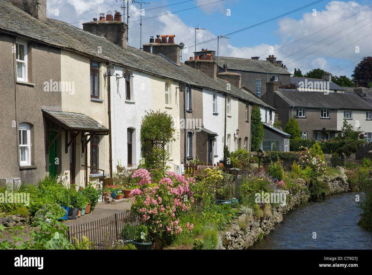 The River Eea running through the village of Cark-in-Cartmel, South ...