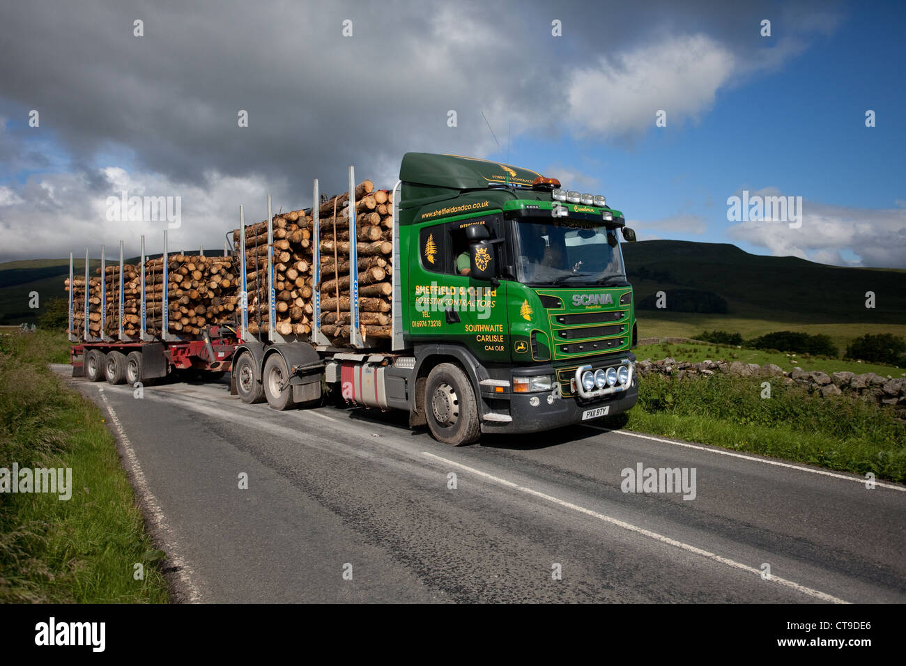 Loaded Timber lorry & trailer transporting cut logs from a Forest in ...