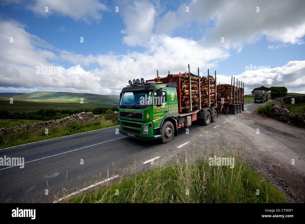 Loaded Timber lorry & trailer transporting cut logs from a Forest in ...