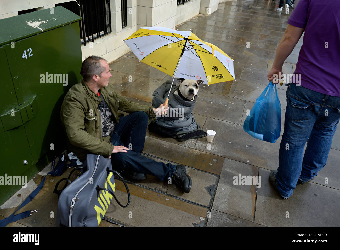 Man begging with dog hi-res stock photography and images - Alamy