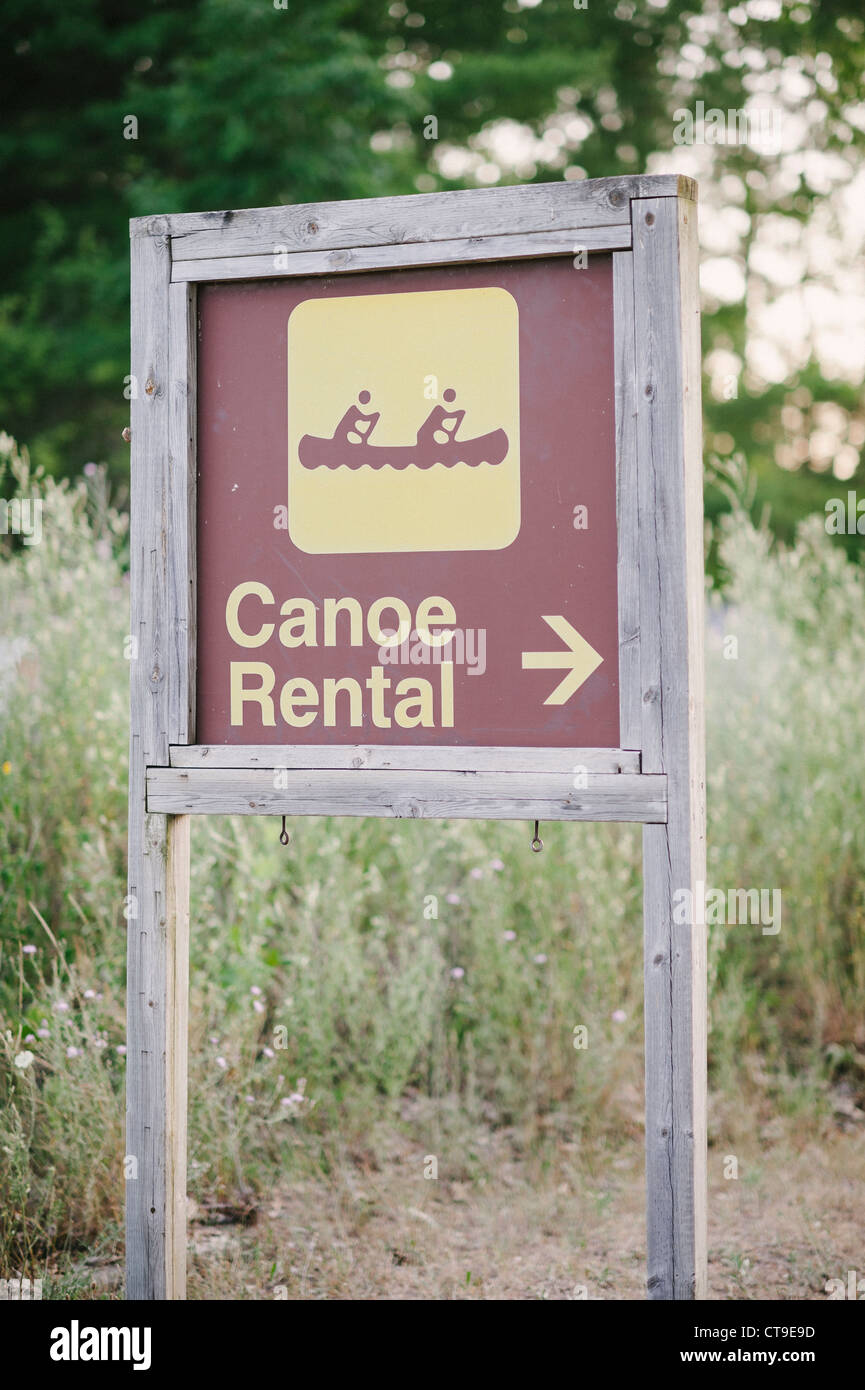 Canoe rental sign Stock Photo - Alamy