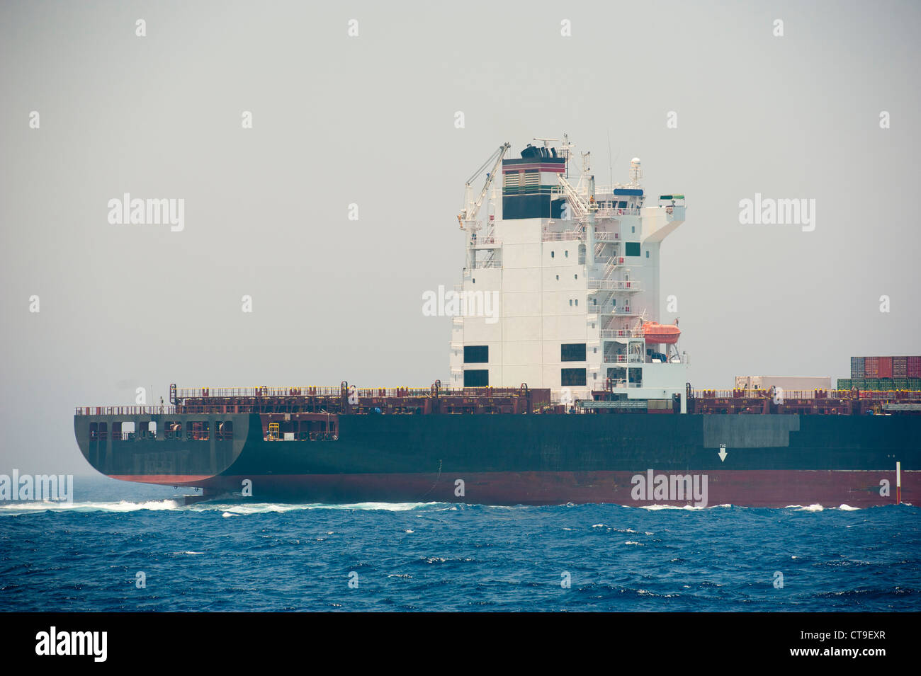 Large industrial container ship under way out at sea Stock Photo - Alamy