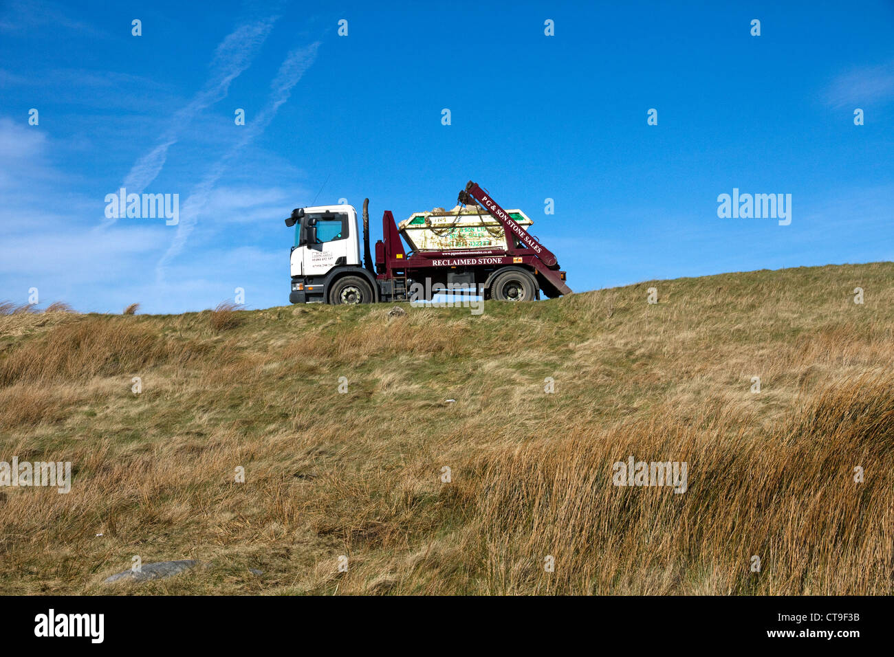 Truck supplying reclaimed stone and quarried Yorkstone. On moorland ...