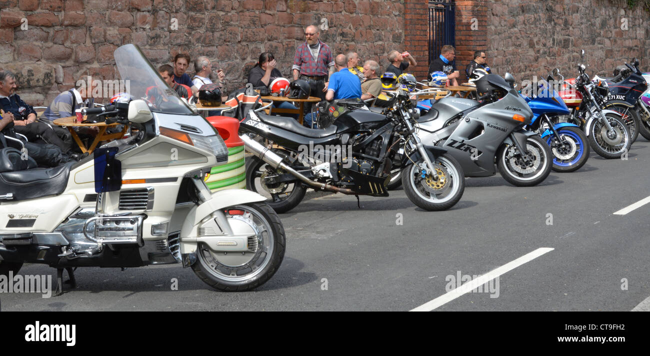 Gathering of motorcycle enthusiasts enjoying refreshments beside the ...