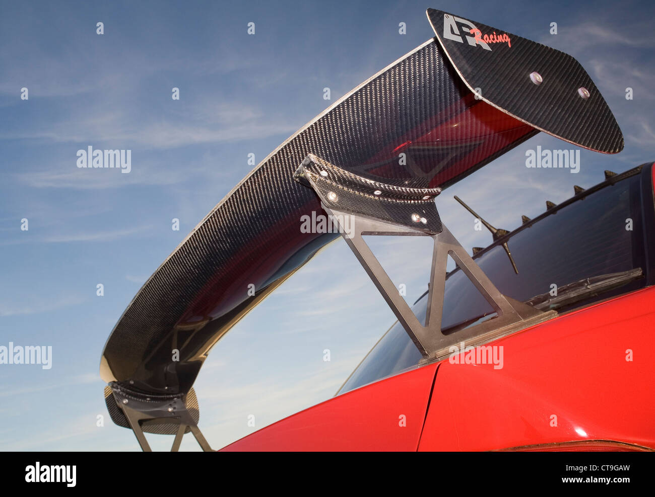 Massive huge aerodynamic carbon fibre wing bolted to the rear of a ...