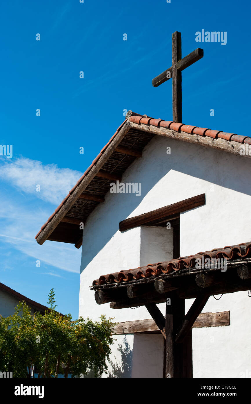Spanish style church with rustic wooden cross Stock Photo - Alamy