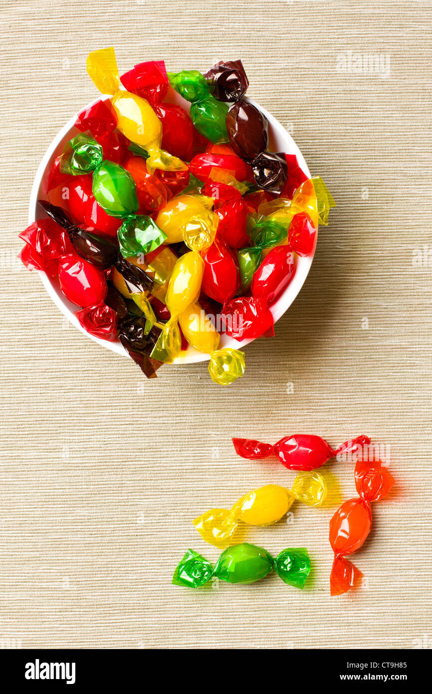 the colored candy wrapped in foil Stock Photo - Alamy